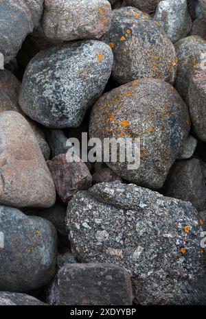 Huge boulders scattered randomly on the site of an old stone pier ...