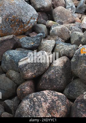 Huge boulders scattered randomly on the site of an old stone pier ...