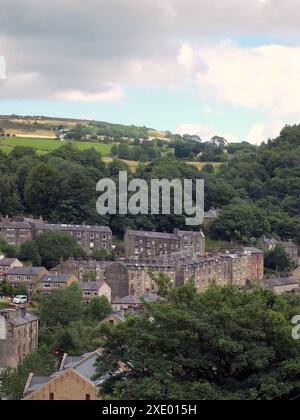 Hillside streets of tall stone houses set in the woodland landscape i ...