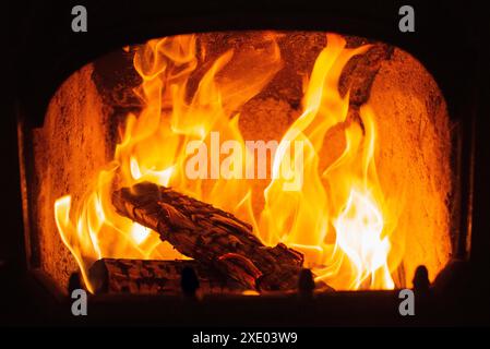 Flame of Wooden logs being burn inside stove Stock Photo - Alamy