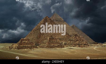 Great pyramids and storm clouds Stock Photo - Alamy