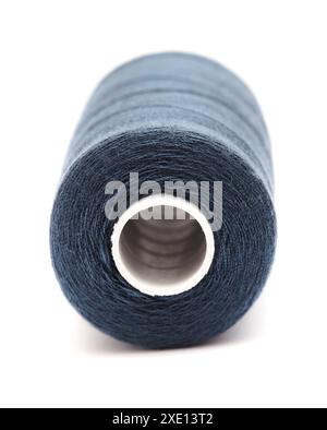 Full cross-wound spool of thin sewing tread isolated on white ...