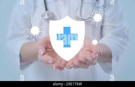 Strong immunity blocking viruses. Doctor holding illustration of shield ...