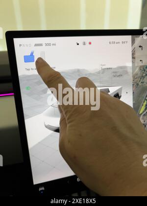 Interacting with Tesla Cybertruck Touchscreen Interface Stock Photo - Alamy