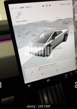 Interacting with Tesla Cybertruck Touchscreen Interface Stock Photo - Alamy