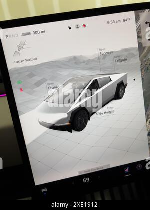 Interacting with Tesla Cybertruck Touchscreen Interface Stock Photo - Alamy