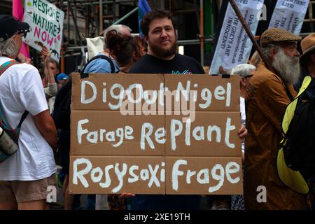 Placard, 'Bee Kind', at the Restore Nature Now march, London, UK, 22 ...