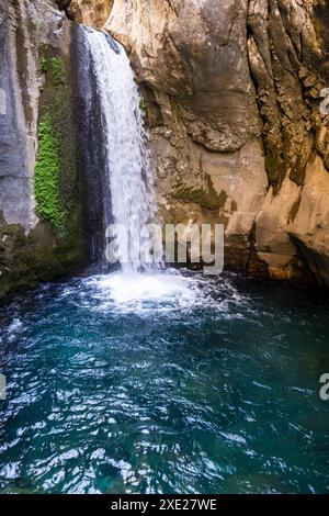 A beautiful mountain gorge with a river and a waterfall Stock Photo - Alamy