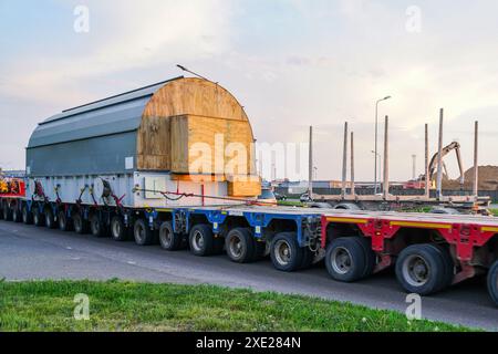 Very long specialized multi axle truck trailer carries very heavy ...
