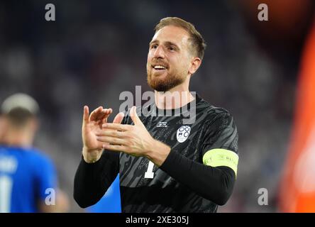 COLOGNE, GERMANY - JUNE 25: Jan Mlakar of Slovenia heads the ball ...