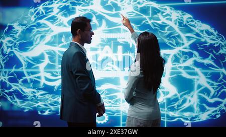 Teamworking colleagues implementing artificial intelligence parallel processing, breaking up ...