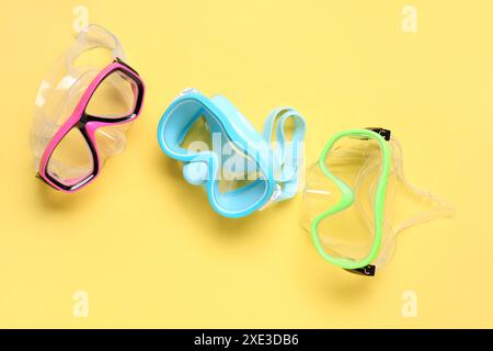 Different swimming masks on yellow background Stock Photo - Alamy