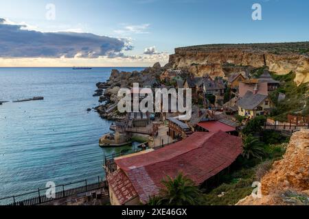 View of idyllic Anchor Bay and Popeye Village amusement park in Malta ...