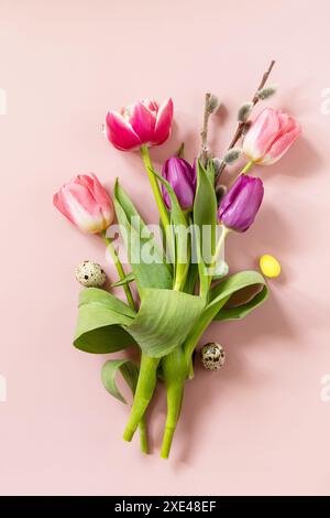 Composition with white tulips and Easter eggs on wooden background ...