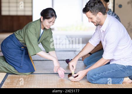 Foreigner making matcha tea Stock Photo - Alamy