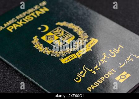 Physical paper international passport of Pakistani citizen on dark ...