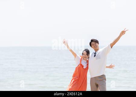 Man and woman frolicking in the sea Stock Photo - Alamy