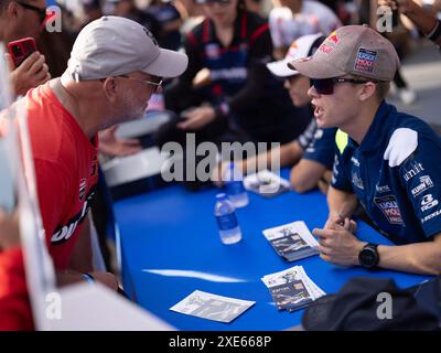 motorbike race rider giving autograph to fans Stock Photo - Alamy