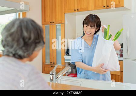 Female carer and female client doing the shopping Stock Photo - Alamy