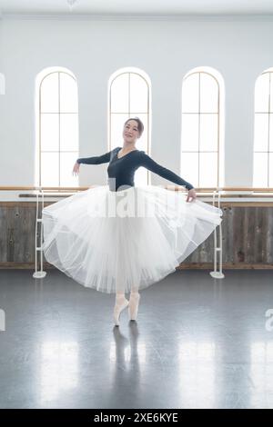 Ballet education school teacher talking to learning student at performance art studio ...