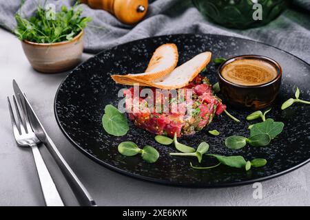 Raw beef tartar snack with capers Stock Photo - Alamy