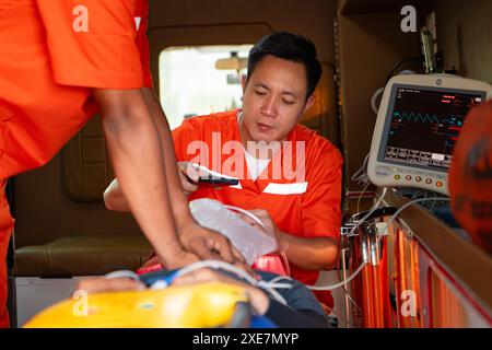 The rescue team is administering CPR to a patient who was involved in ...