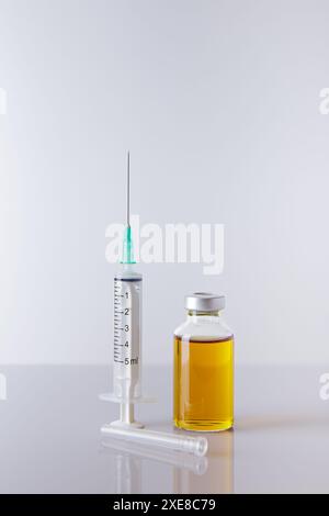 Bottle of insulin with syringe on white background. Diabetes concept ...