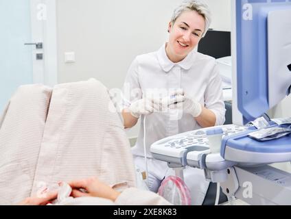 Gynecologist doing ultrasound scan in modern clinic Stock Photo - Alamy