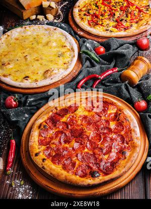 Pizza party dinner. Table with various kinds of Italian pizza, salad ...