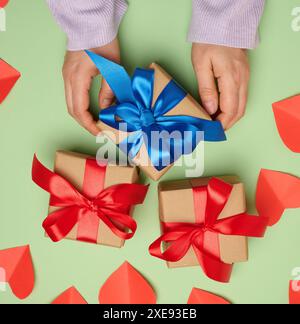 A woman's hand on a red silk crumpled background in the dark, a woman's hand Stock Photo - Alamy