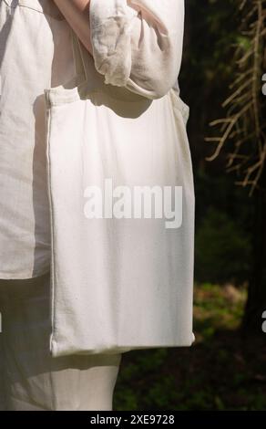 Tote bag mock up on shoulder of woman in sweater. Eco bag mockup Stock ...