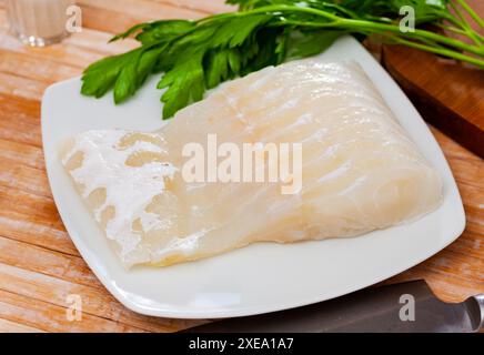 Raw pink cusk-eel fish fillet, seafood ingredients Stock Photo - Alamy