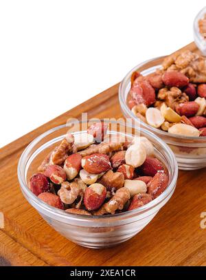 Pile of assorted nuts on wooden background Stock Photo - Alamy