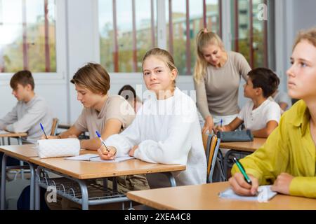 Student is sitting test and answer about task in classroom Stock Photo ...