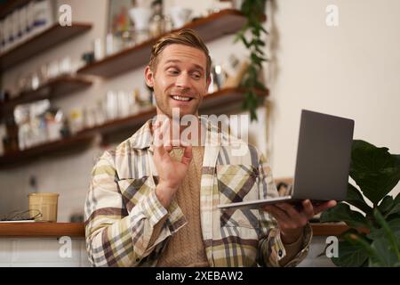 Relaxed guy smiling, showing okay signs, approve or agree, standing ...