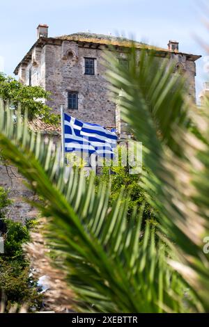 Ancient Ouranoupolis Tower on Athos peninsula in Halkidiki, flag of ...