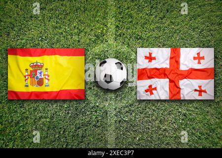 Spain vs. Georgia flags on green rugby field Stock Photo - Alamy