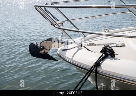 Sailing boat bow with mantus anchor on sea waters background Stock ...