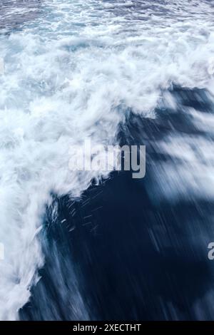 Sea water churned up into foam by the engine of a small boat Stock ...