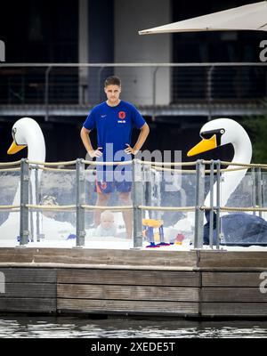 A person cools off in front of a Chicago Fire Department during a hot ...