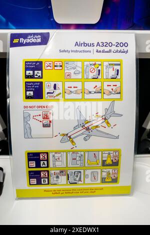 Airplane seat cabin safety instructions sheet information on seat table ...