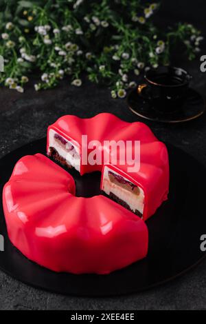 Contemporary Chocolate Cherry Mousse Cake covered with cherry icing ...
