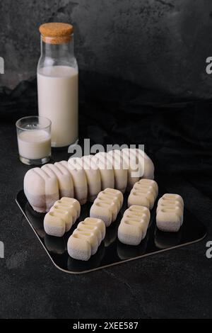 three chocolate mousse cakes with milk Stock Photo - Alamy