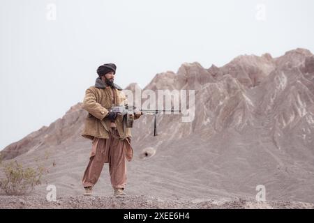 A Taliban soldier stands with a machine gun, Surrender to the allied ...