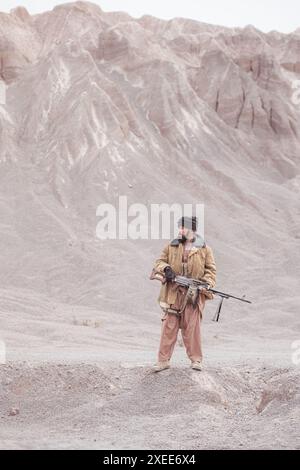 A Taliban soldier stands with a machine gun, Surrender to the allied ...