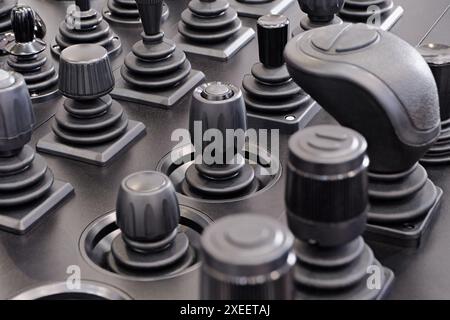 Big group of various control sticks on a black dashboard Stock Photo ...