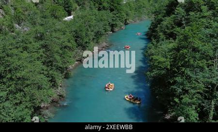 Rafting on a mountain river, a yellow inflatable sports boat is ...