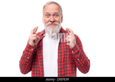 Lucky carefree stylish mature man beard grey hair raising hands ...