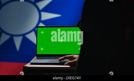 Taiwanese insurgent using military tech on green screen laptop to ...