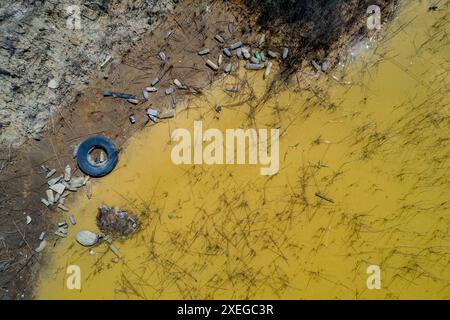 Drone aerial of lake polluted with waste garbage. Environmental ...